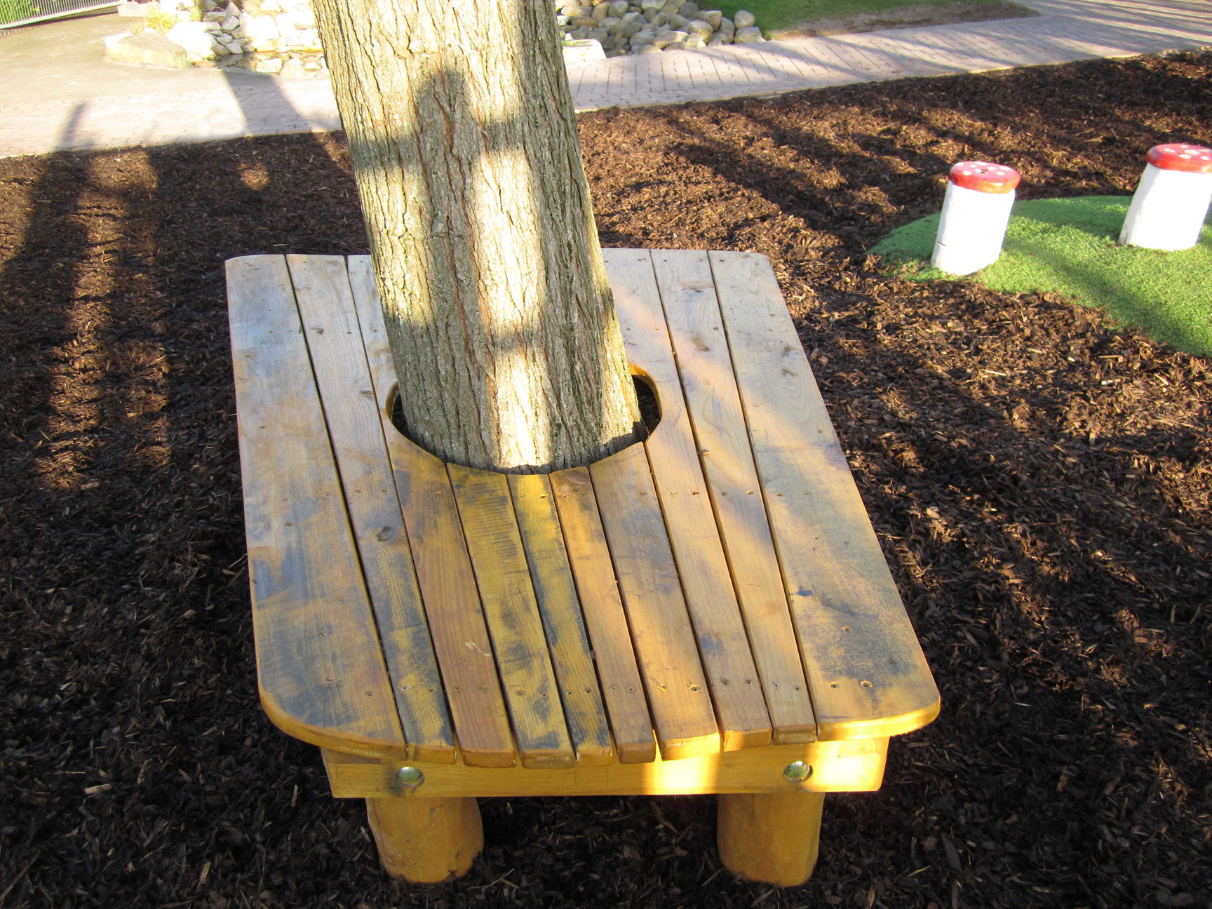 Platform Seating around tree | The Children's Playground Company